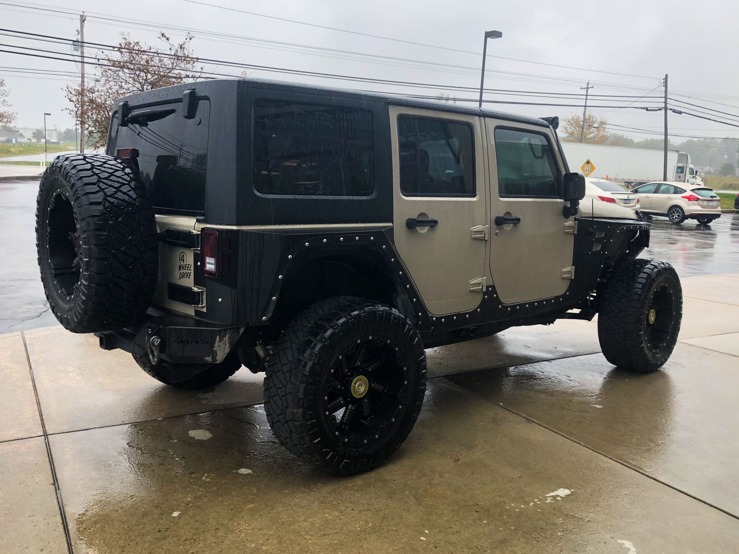 *Sold* 4-Door Tan Jeep Wrangler | PickupsPlusCars